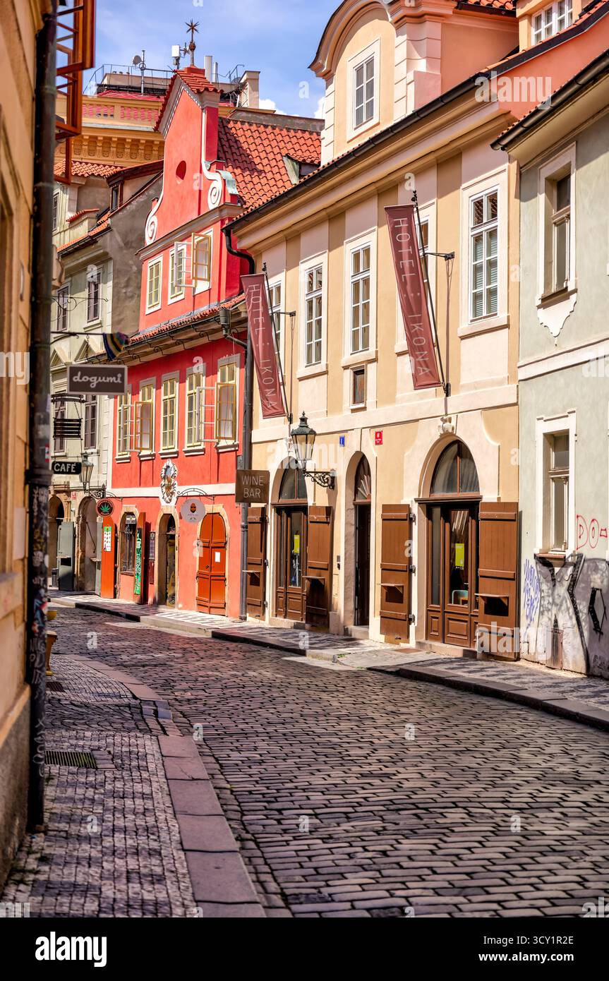 Charming cobblestone street lined with colorful historic buildings in ...