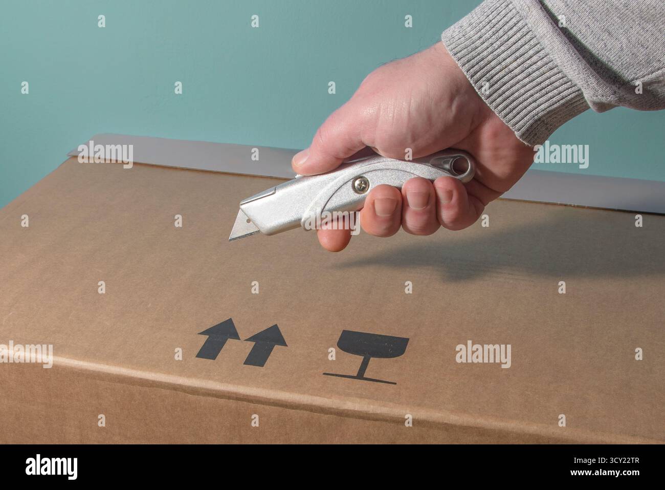 Cutting large cardboard product packaging with the Utility Knife Stock ...