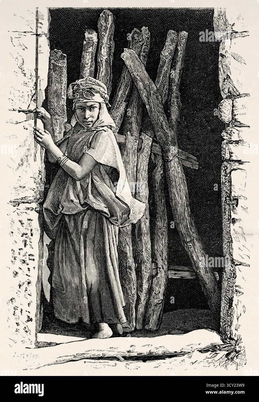 Young woman at the door of a house in Dougga, Tunisia, North Africa ...