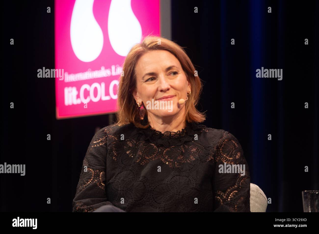 Line Holm, a writer, is on the stage of COMEDIA Theater in Cologne ...