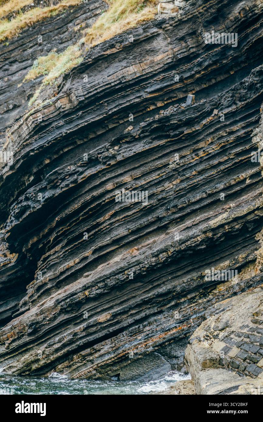 Striking diagonal sedimentary rock layers revealing millions of years ...