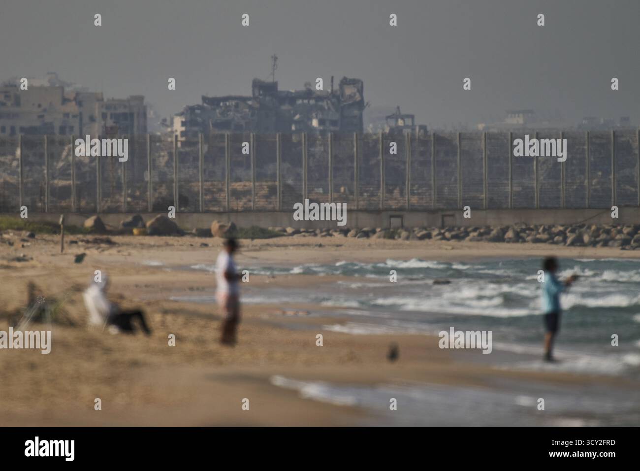 Backdropped by buildings destroyed during Israeli ground and air ...