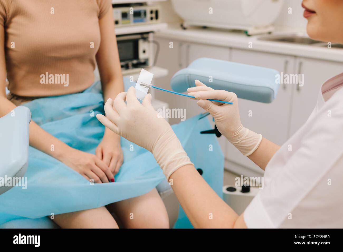 Cervical cells are applied to a microscope slide for examination. A Pap ...