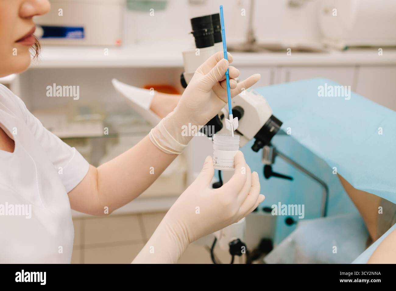 Gynecologist collects a Pap smear sample for cervical screening ...