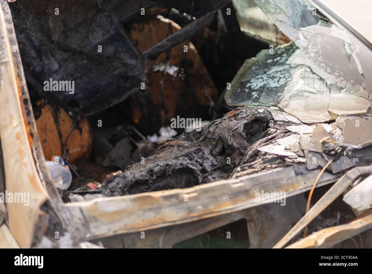 The remains of a burnt car reveal extensive fire damage inside the ...