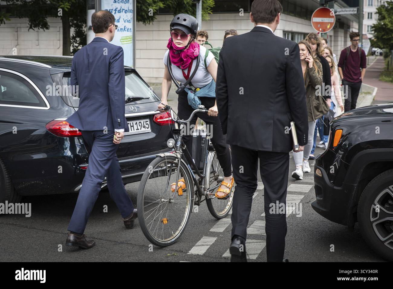 DEU Germany Germany Berlin Cyclist and pedestrian queue through heavy ...