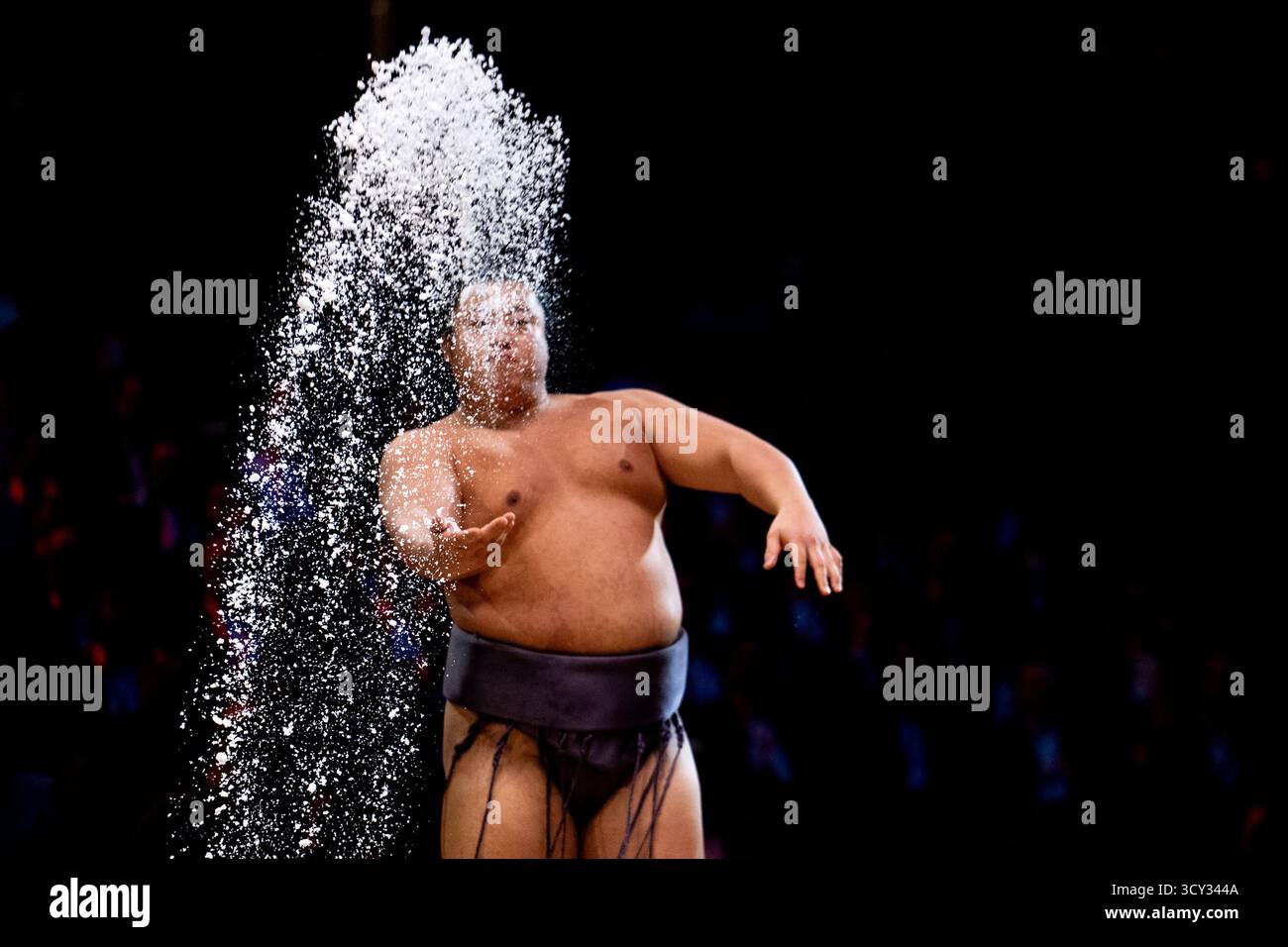 Tobizaru throws salt before the Makuuchi Division bout against Kotoeiho ...