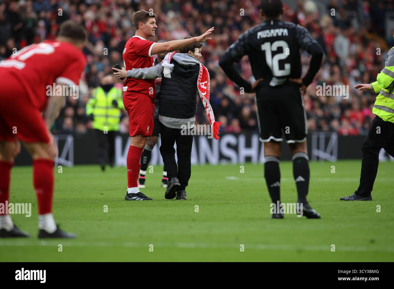 Pitch invader with Steven Gerrard during Liverpool FC Legends vs Ajax ...