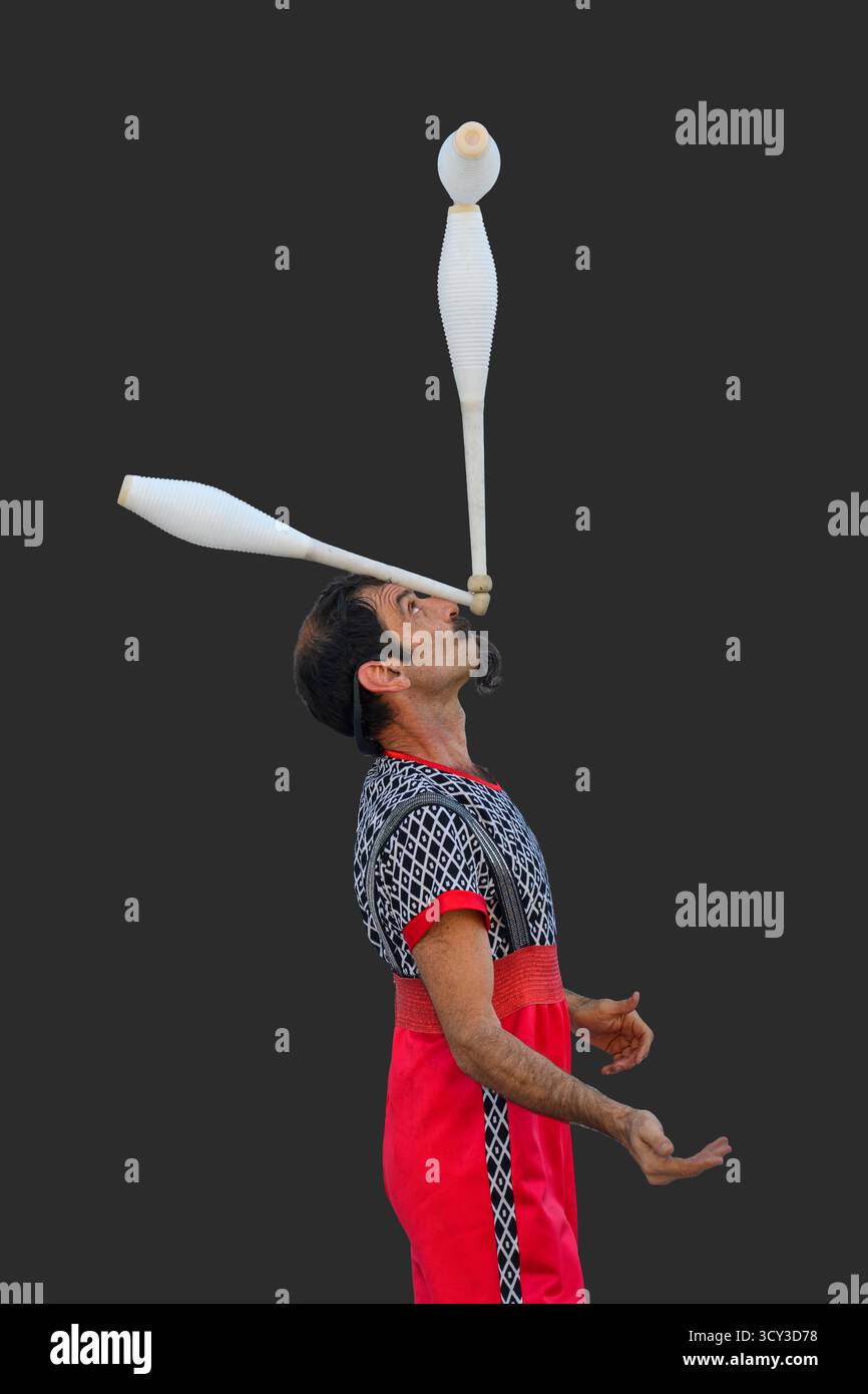 Male juggler balancing three hi-res stock photography and images - Alamy