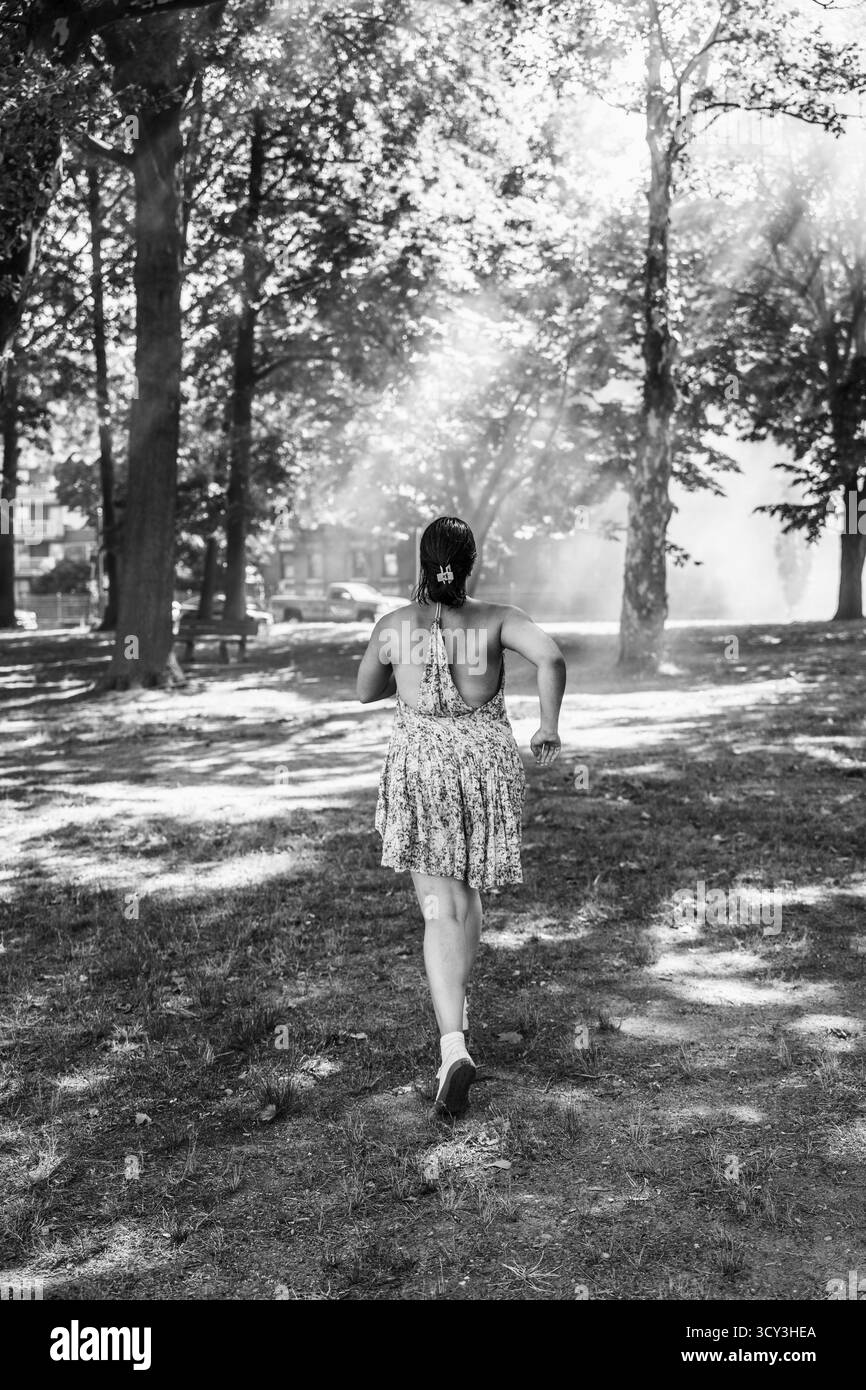 Person in sunlight light Black and White Stock Photos & Images - Alamy