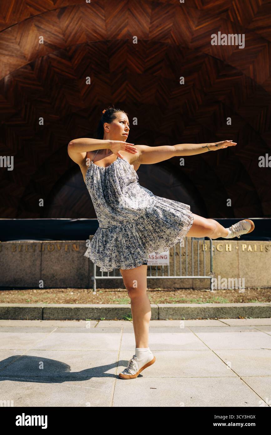 Woman dancing expressing movement outdoors in summer Stock Photo - Alamy
