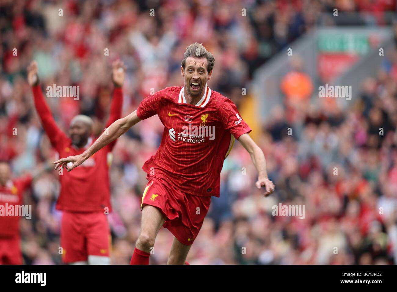 Peter Crouch celebrating his goal at the match Liverpool FC Legends vs ...