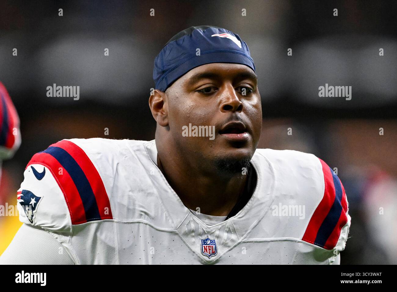 New England Patriots offensive tackle Vederian Lowe walks off the field ...