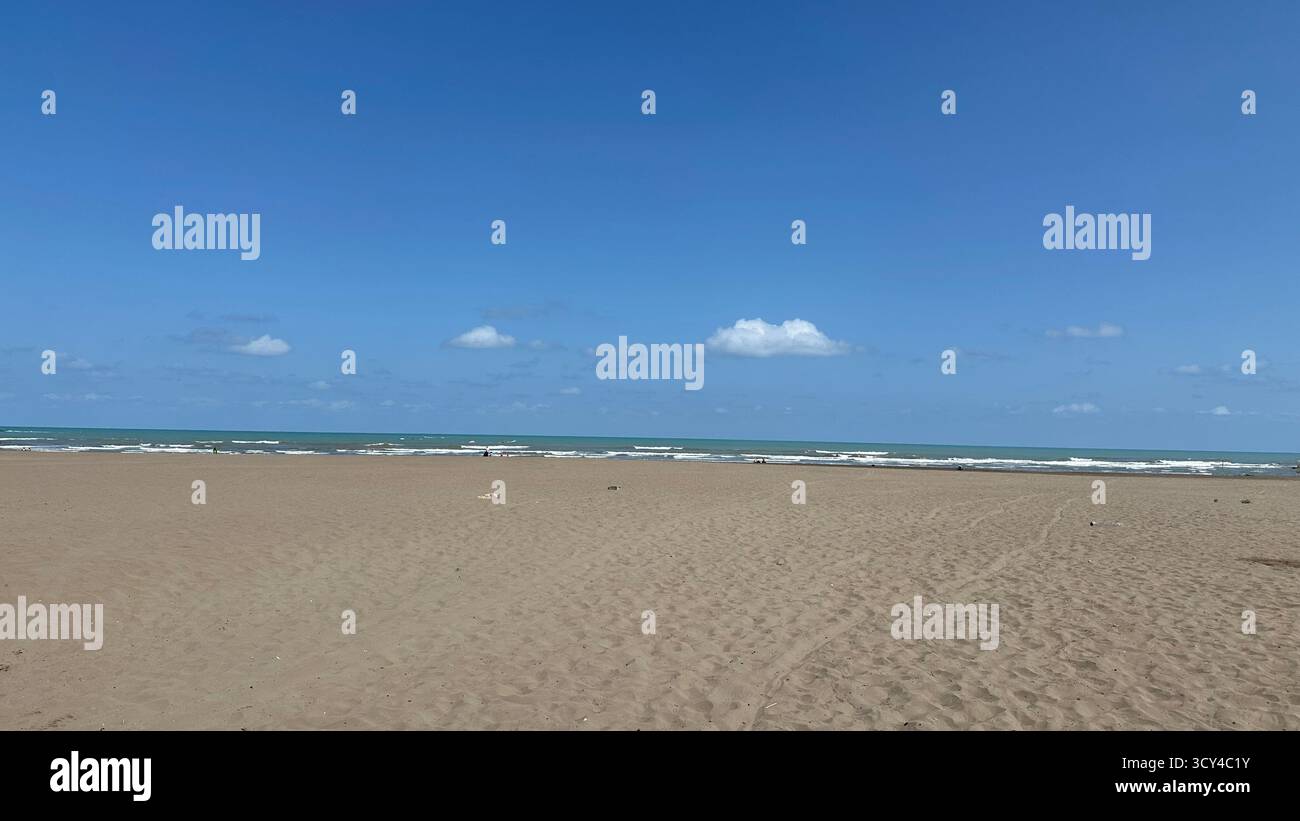 boat on sandy Caspian Sea beach under blue sky in Iran Stock Photo - Alamy