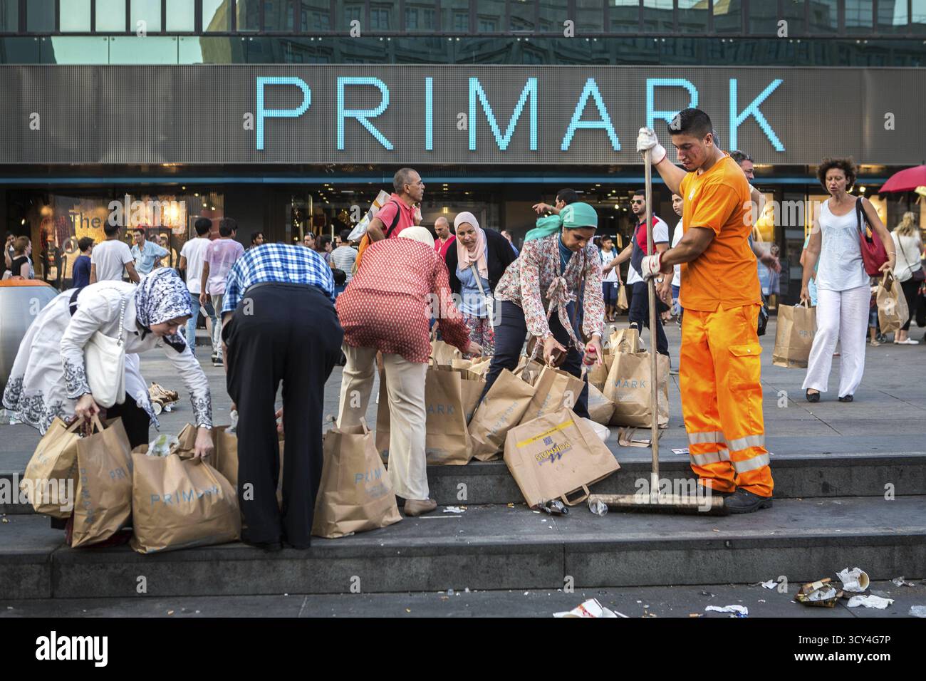 DEU Germany Germany Berlin Women wearing headscarves with shopping bags ...