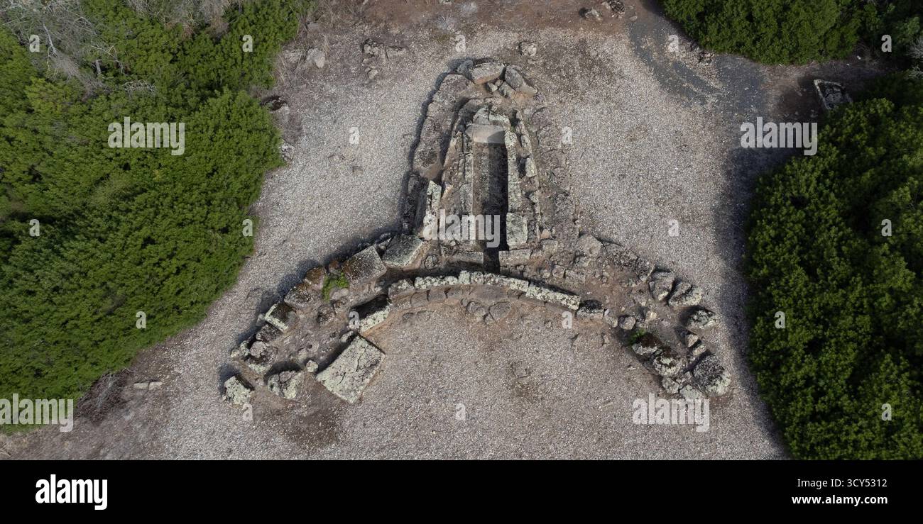 Drone view of a Sardinian prehistoric tomb with trilobed structure and ...