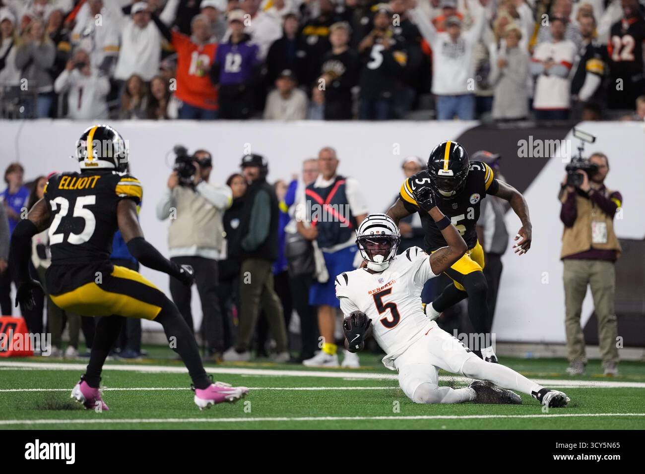 Cincinnati Bengals wide receiver Tee Higgins (5) slides down after ...