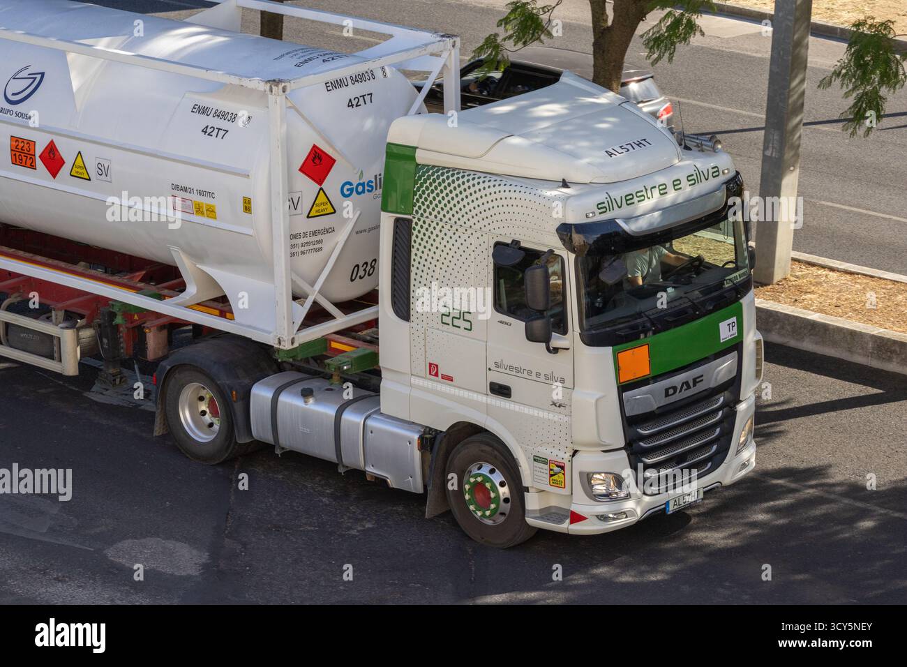 Tanker truck moving hazardous liquid cargo by road, showing an adr ...