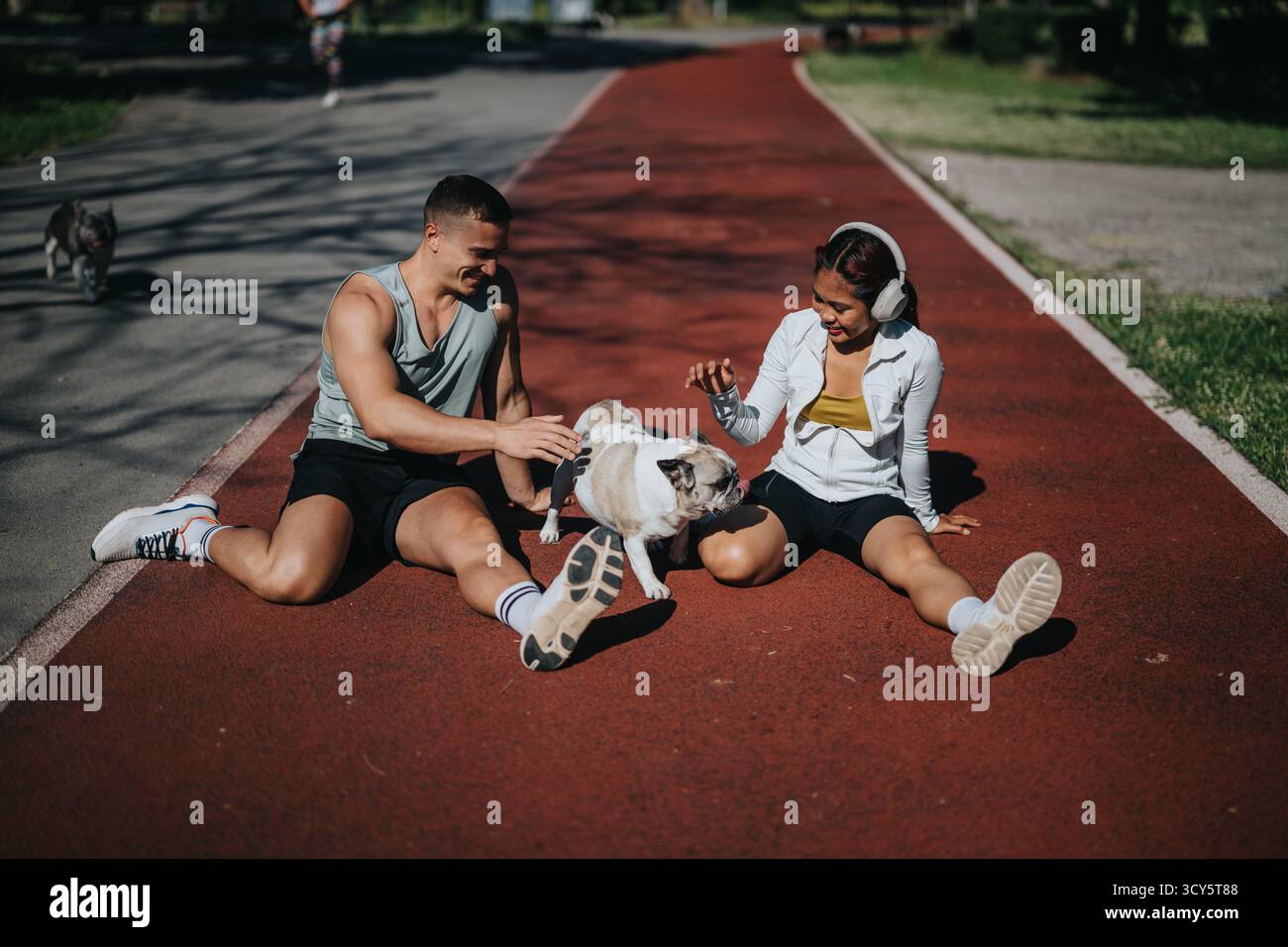 Diverse sporty couple relaxing hi-res stock photography and images - Alamy