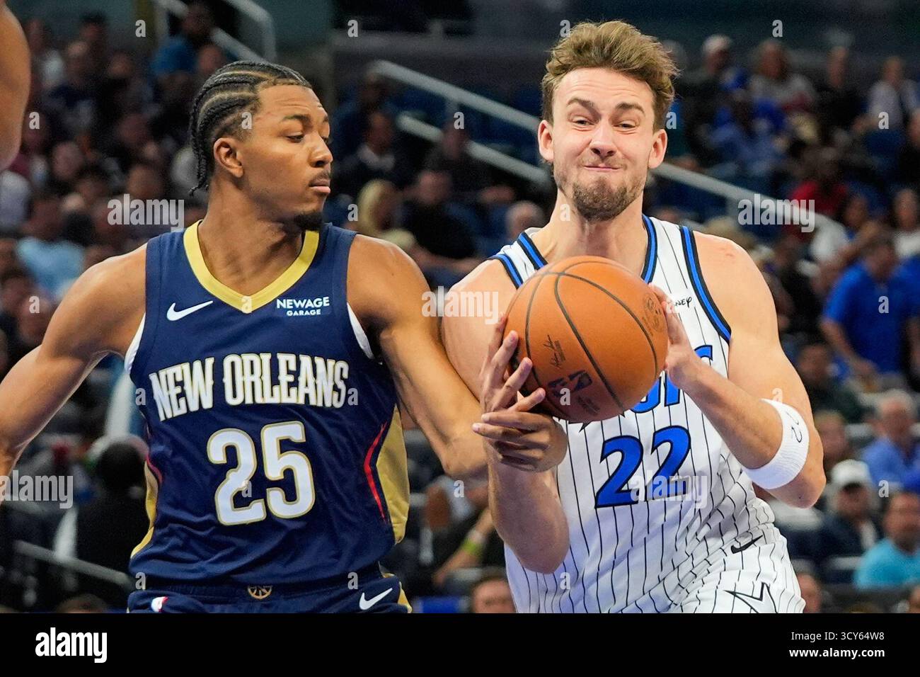 Orlando Magic forward Franz Wagner (22) drives around New Orleans Pelicans forward Trey Murphy ...