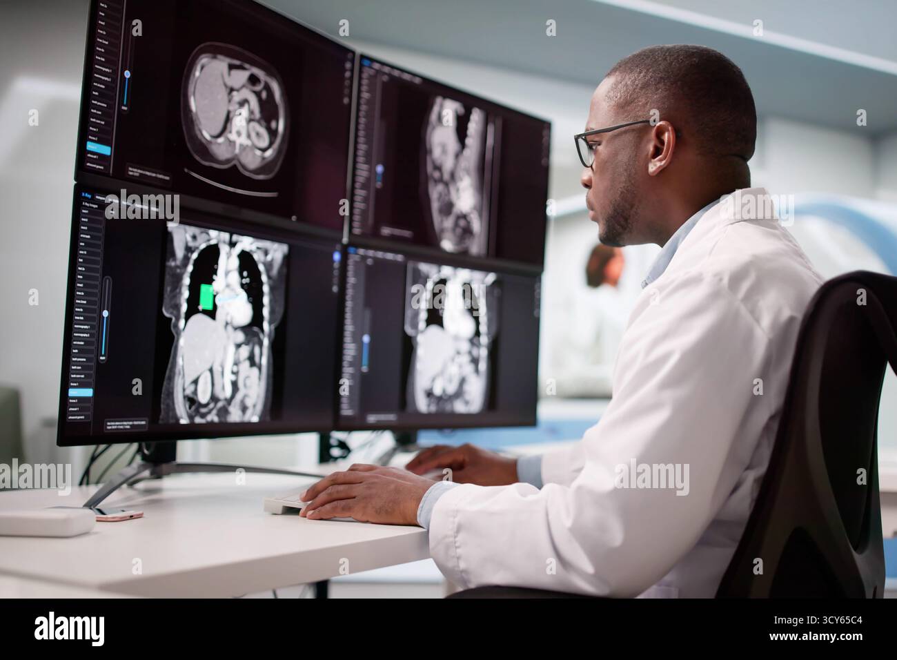 Skilled Surgeon Analyzing MRI Scan Using Desktop Computer In Hospital ...