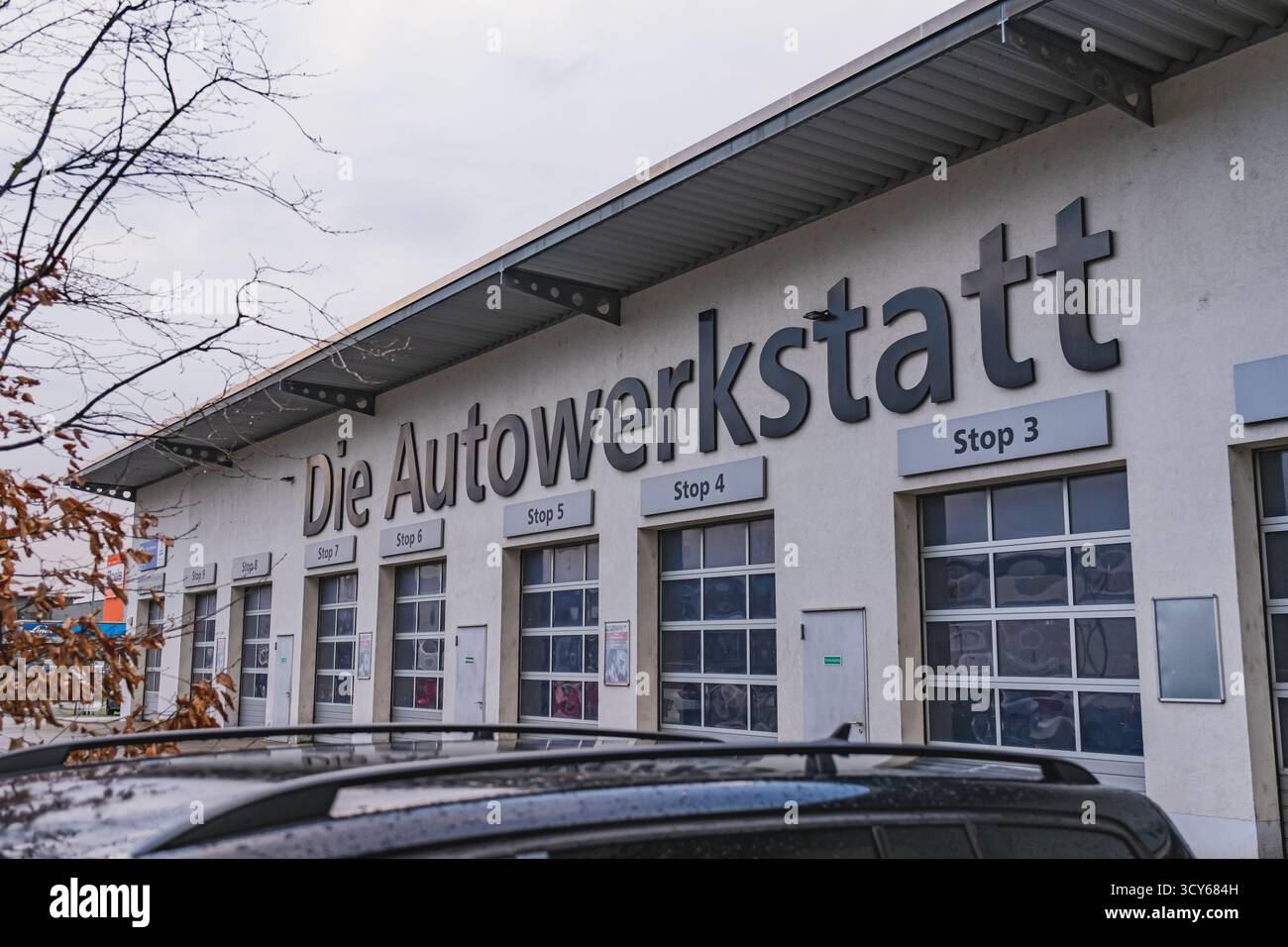 Car repair shop building (Autowerkstatt) with closed entrances for ...
