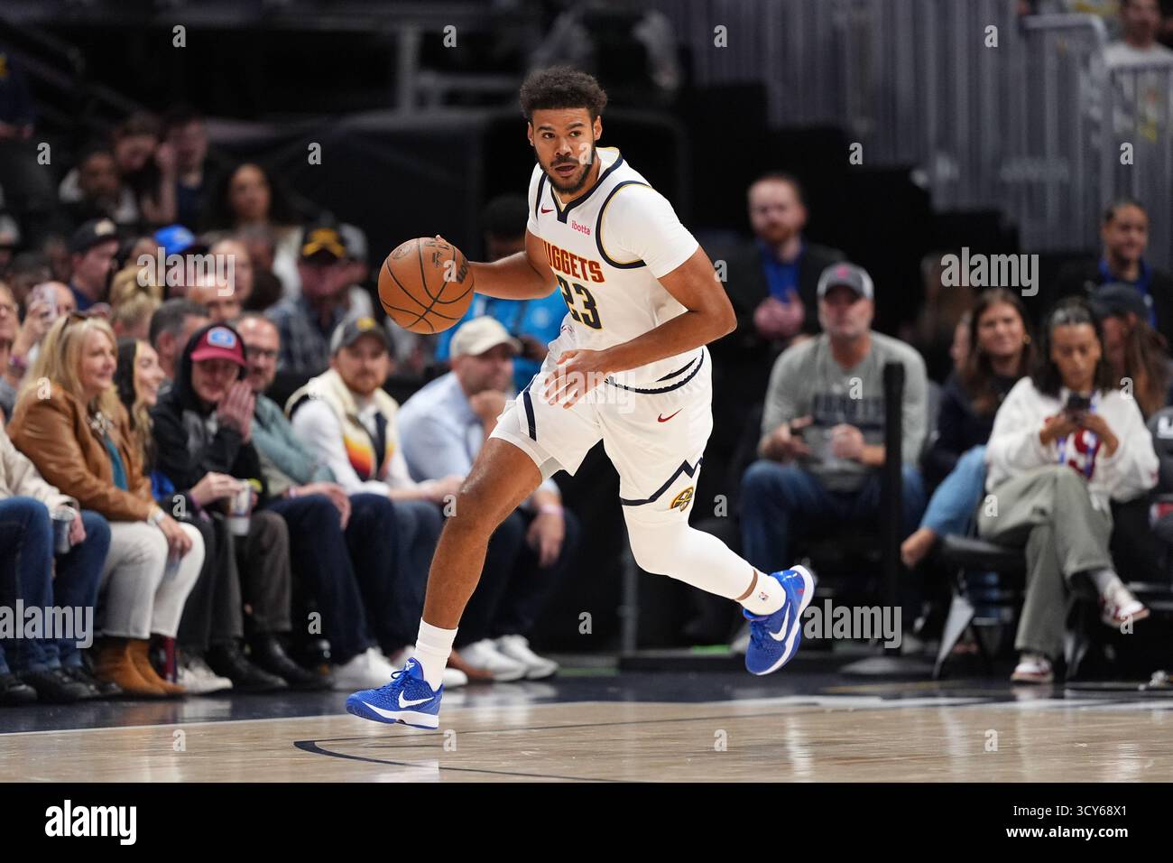 Denver Nuggets forward Cameron Johnson brings the ball up court against ...