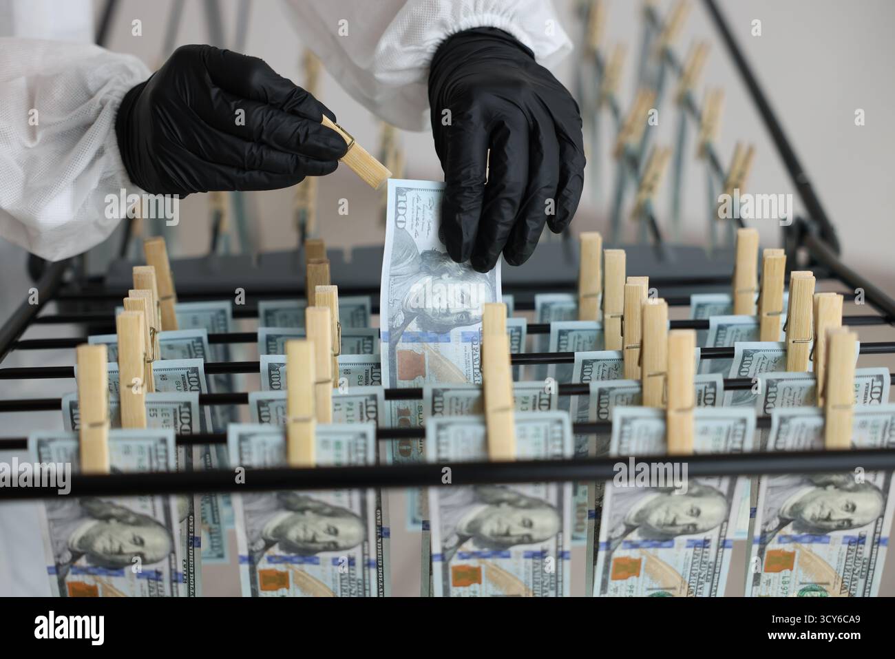 Money laundering woman hanging banknotes hi-res stock photography and ...
