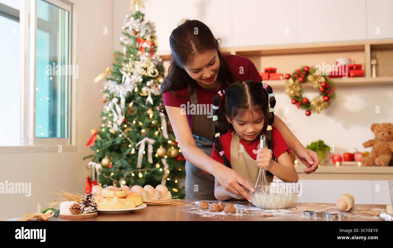 Baking Memories: Mother and Daughter Preparing Holiday Cookies Together ...