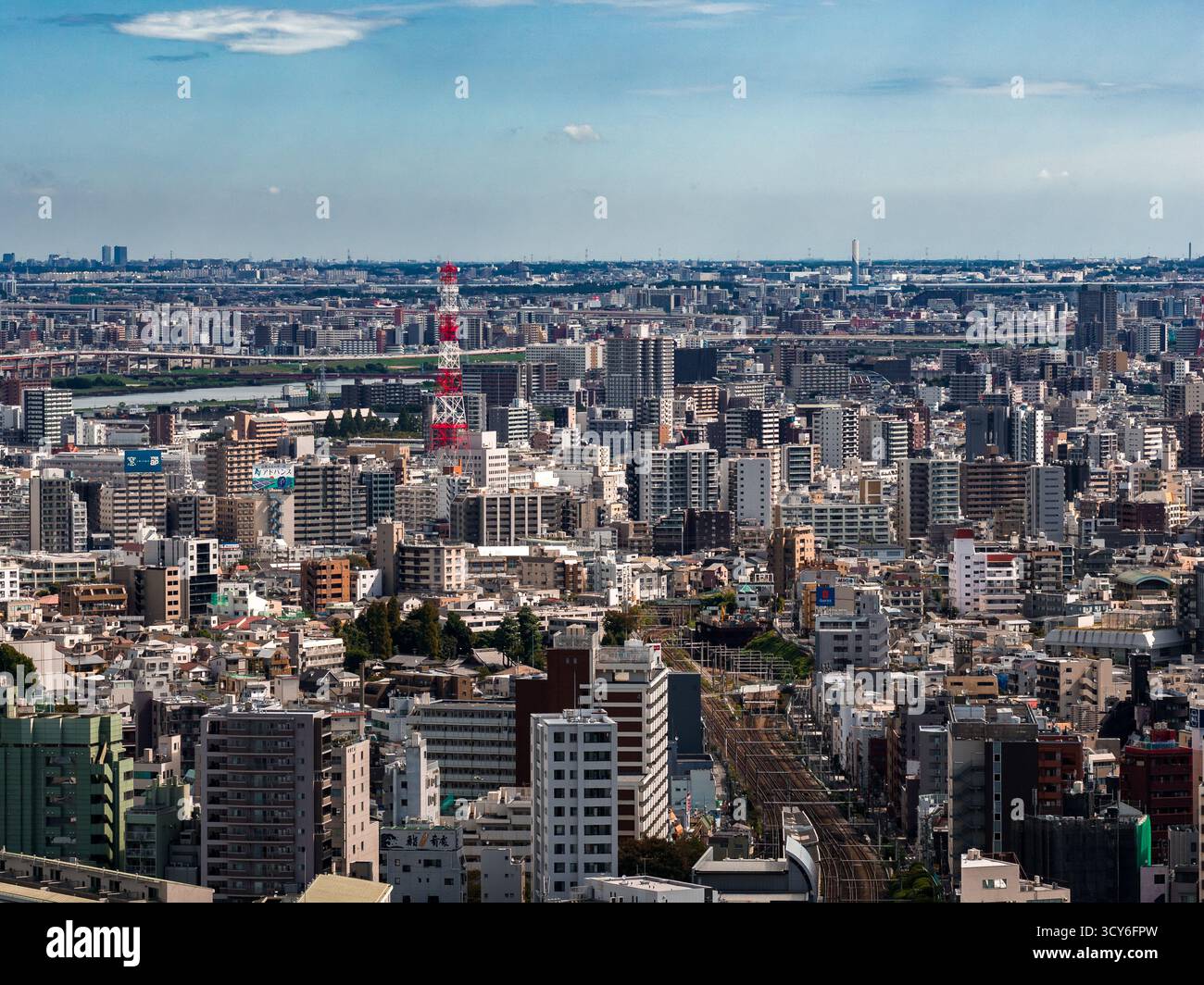 Aerial daytime view of Tokyo with rail lines, rivers, and tower Stock ...