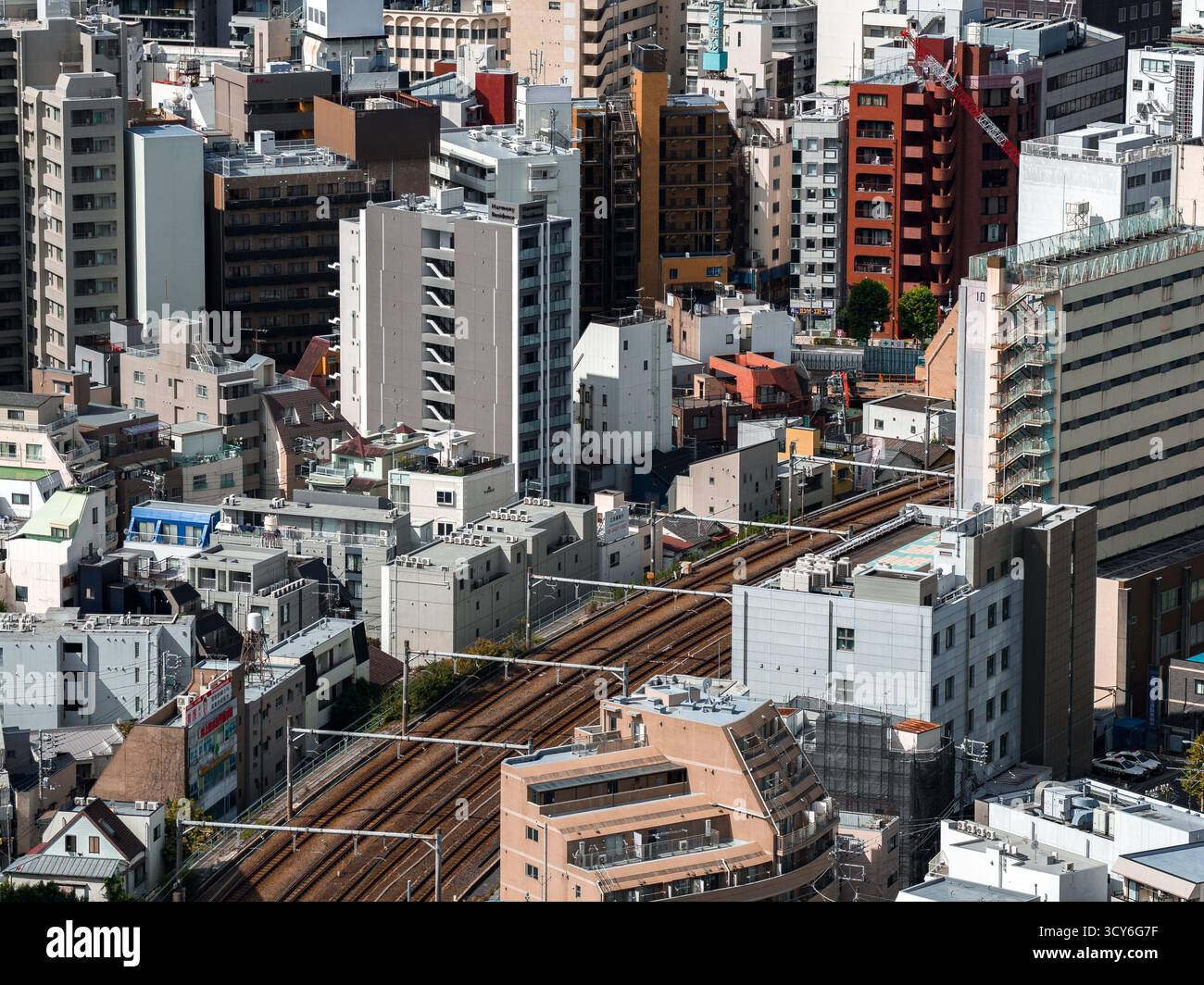 Aerial view of central Tokyo rail lines and dense mid rise towers Stock ...