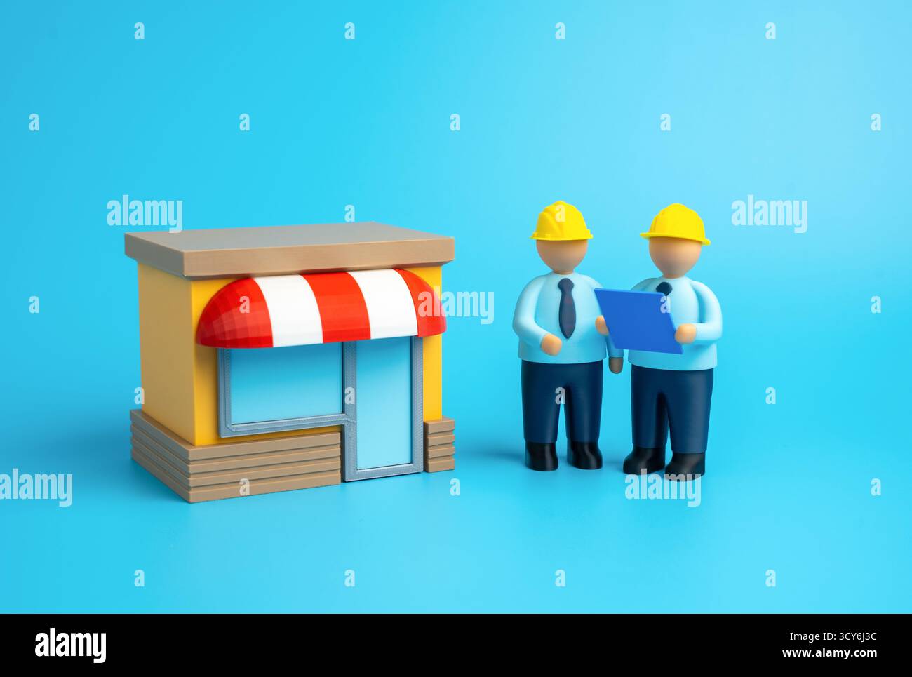 Construction workers with blue drawings stand near a newly built store ...