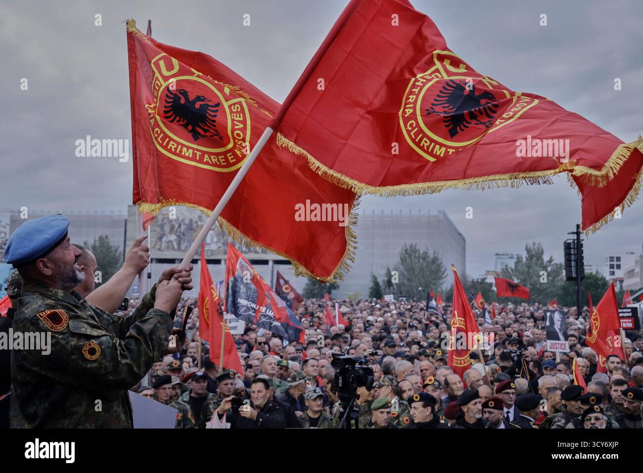 Protesters wave Kosovo Liberation Army (UCK) flags as they take part in ...