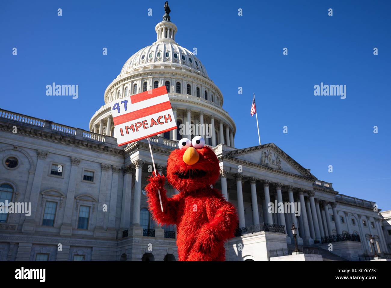 A protester dressed as Elmo, a Sesame Street character, calls for the ...