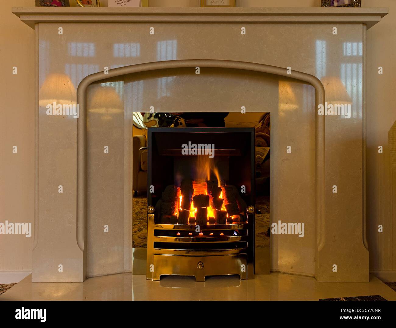 modern traditional marble fireplace with burning coal effect gas fire ...