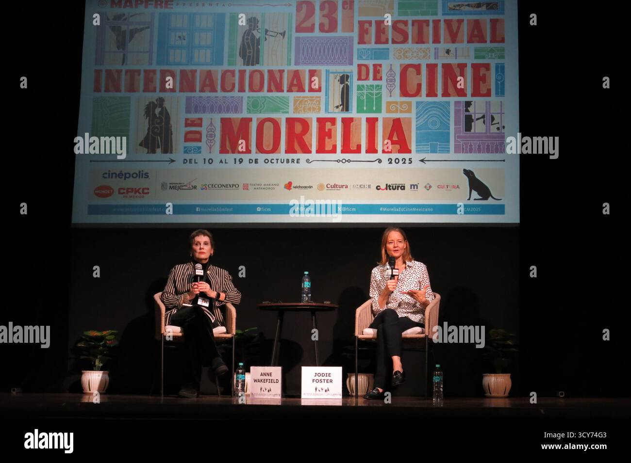 Actor Jodie Foster, right, speaks during a conference with host Anne ...