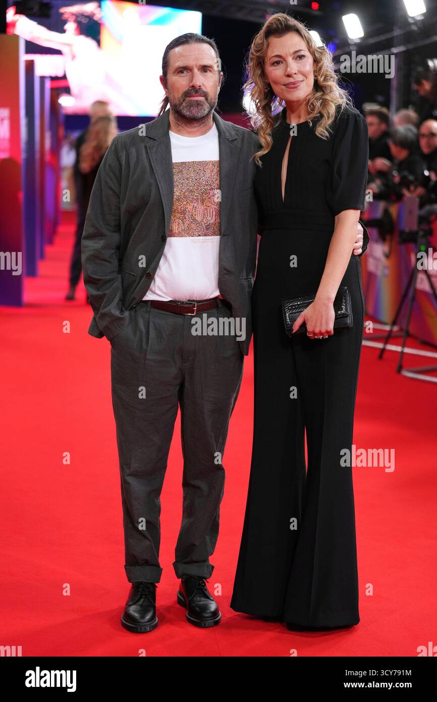 David Michod, left, and Mirrah Foulkes pose for photographers upon ...