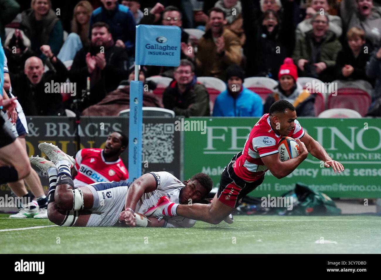Gloucester Rugby's Will Joseph (right) scores a try during the ...