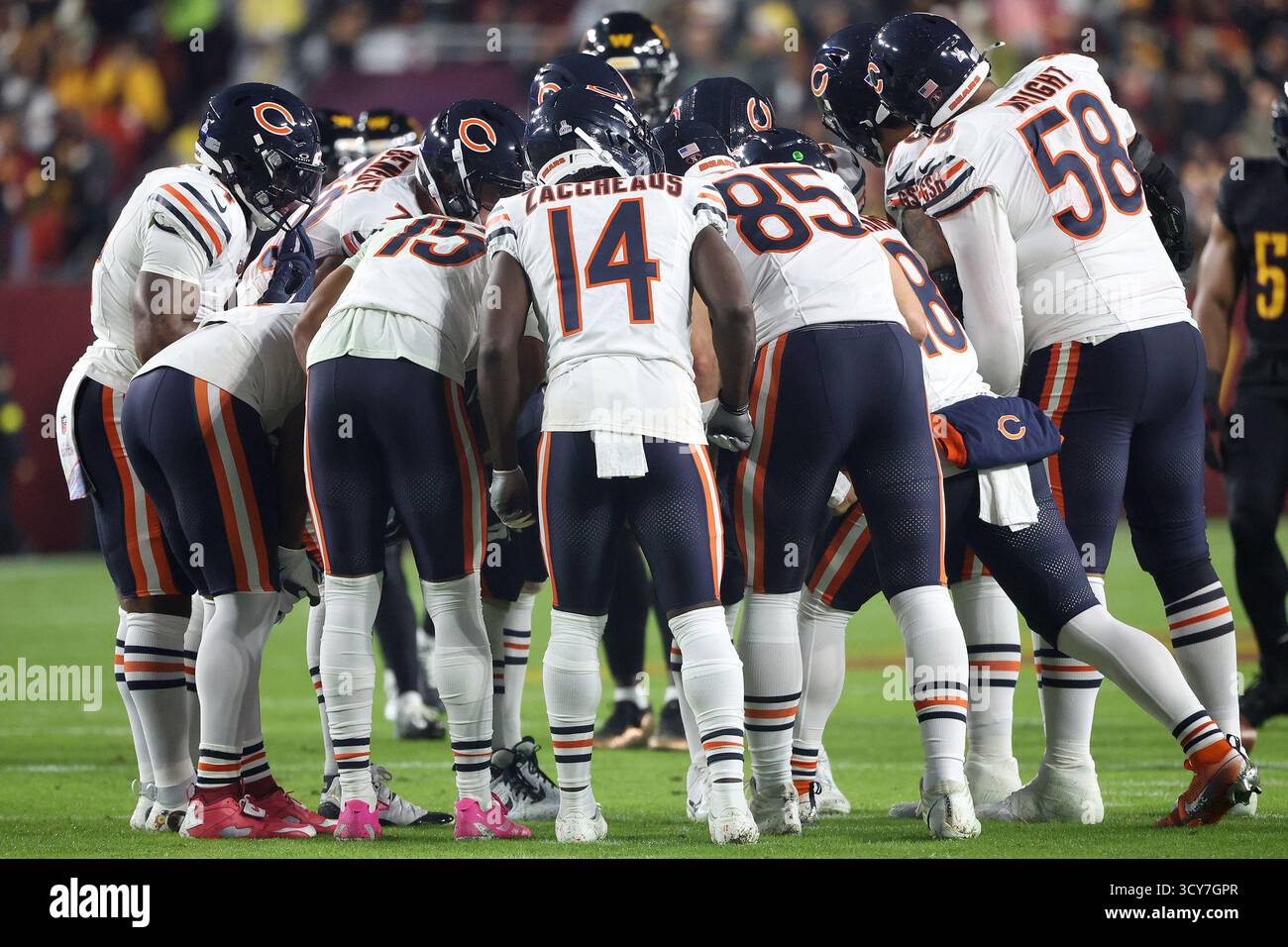 Chicago Bears players huddle up during an NFL football game against the ...