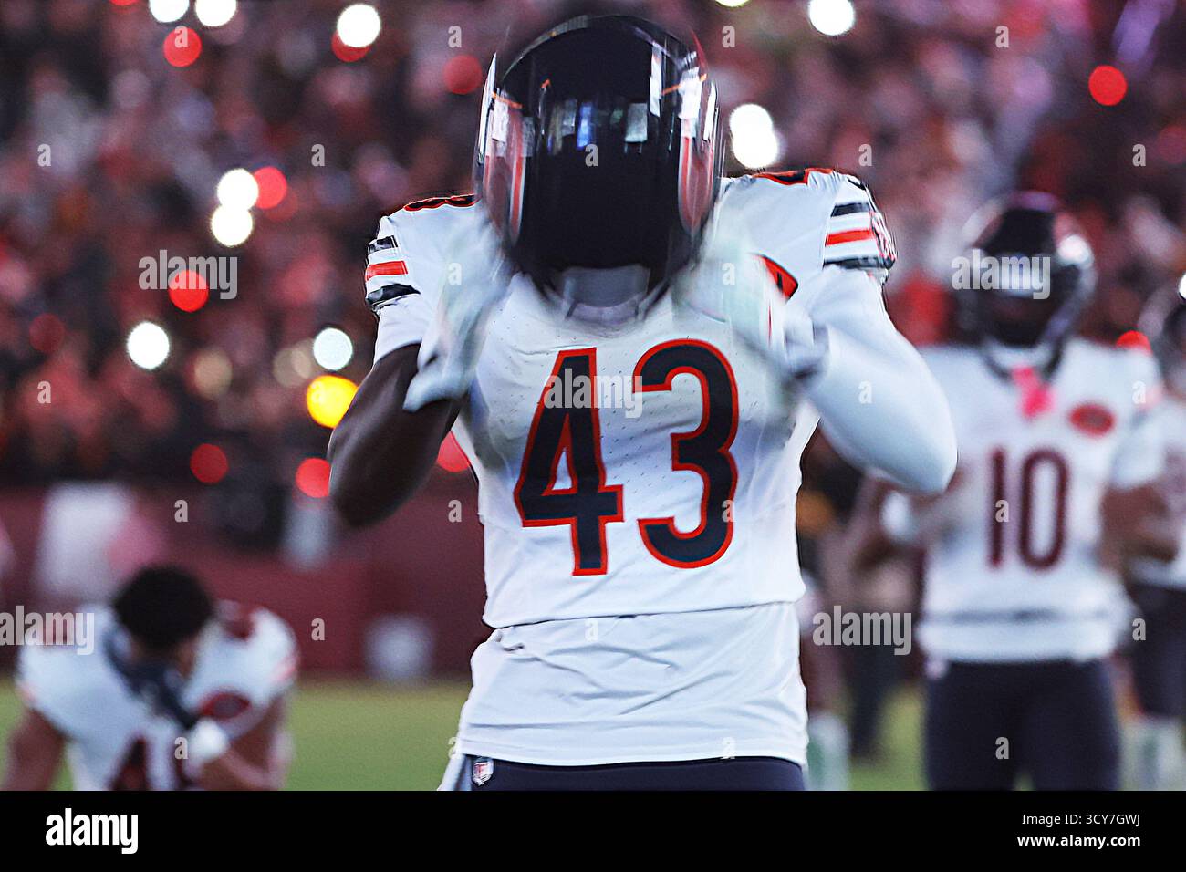 Chicago Bears linebacker Carl Jones Jr. (43) takes off his helmet ...