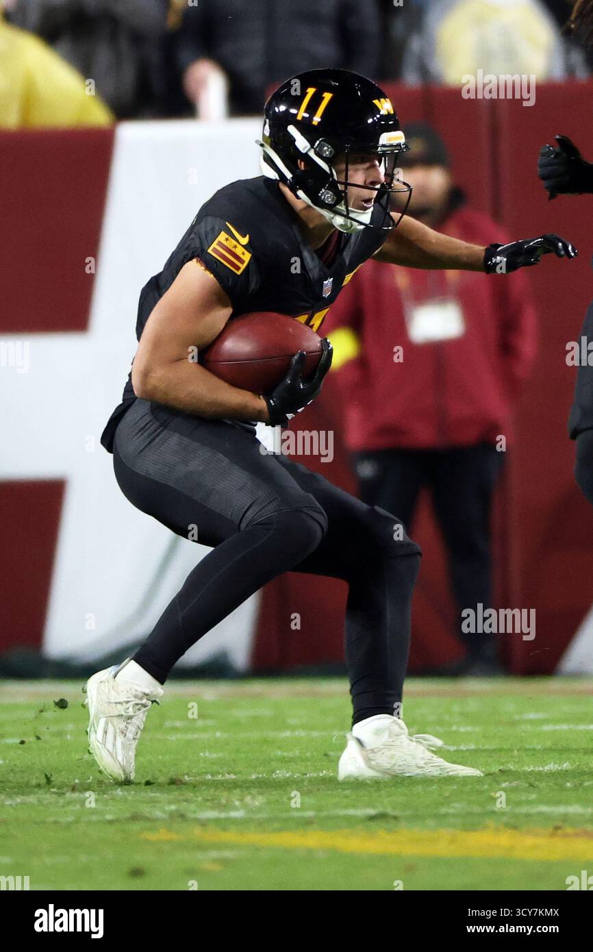 Washington Commanders wide receiver Luke McCaffrey (11) runs with the ...