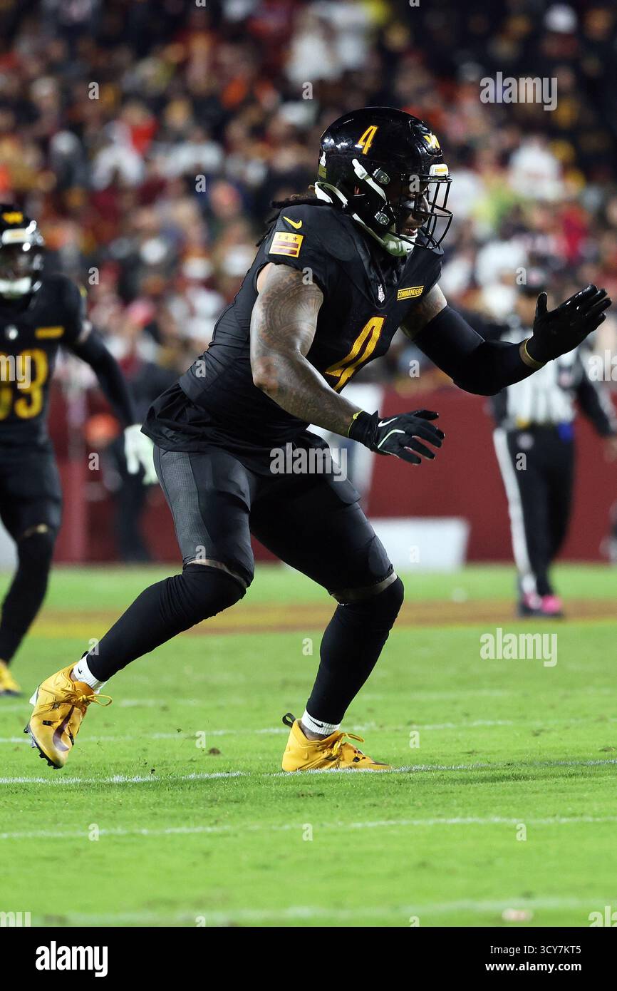 Washington Commanders linebacker Frankie Luvu (4) rushes during an NFL ...