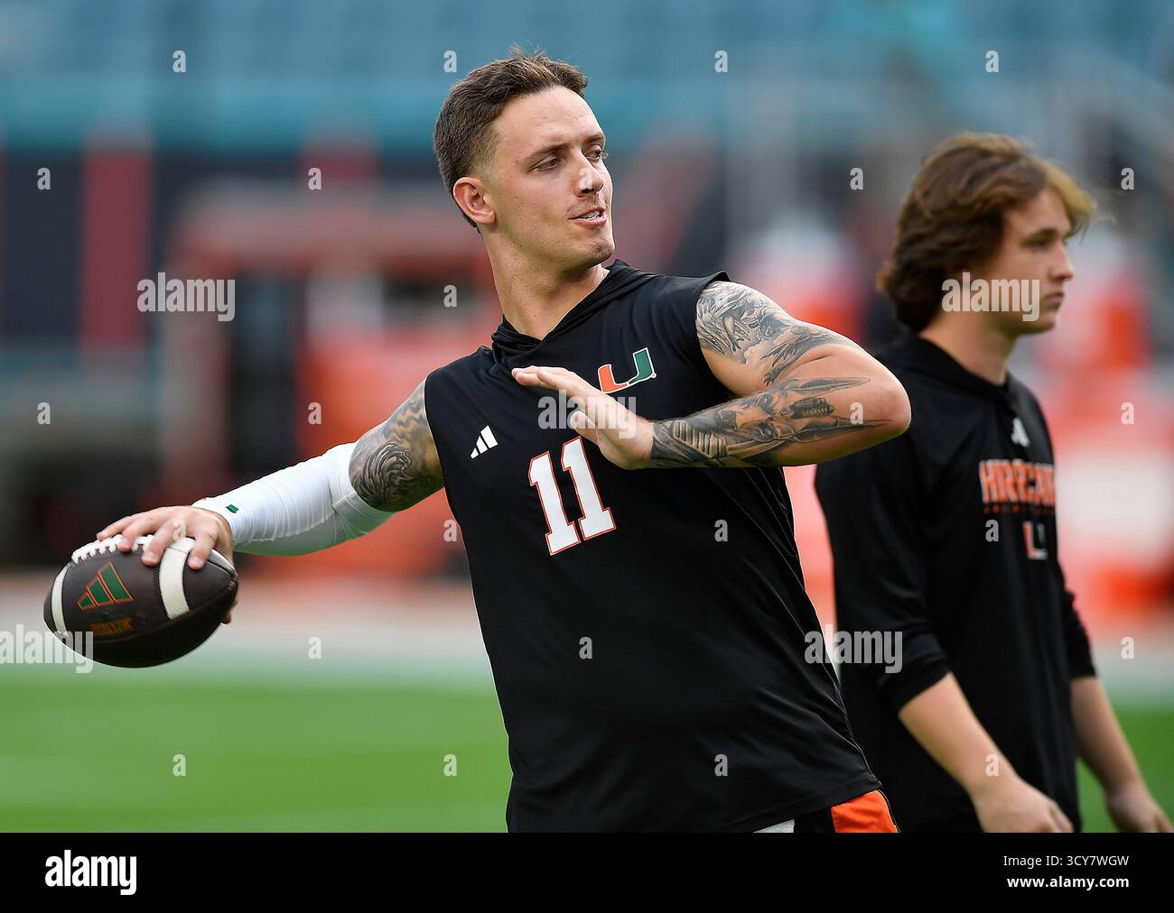 Miami quarterback Carson Beck warms up before an NCAA college football ...