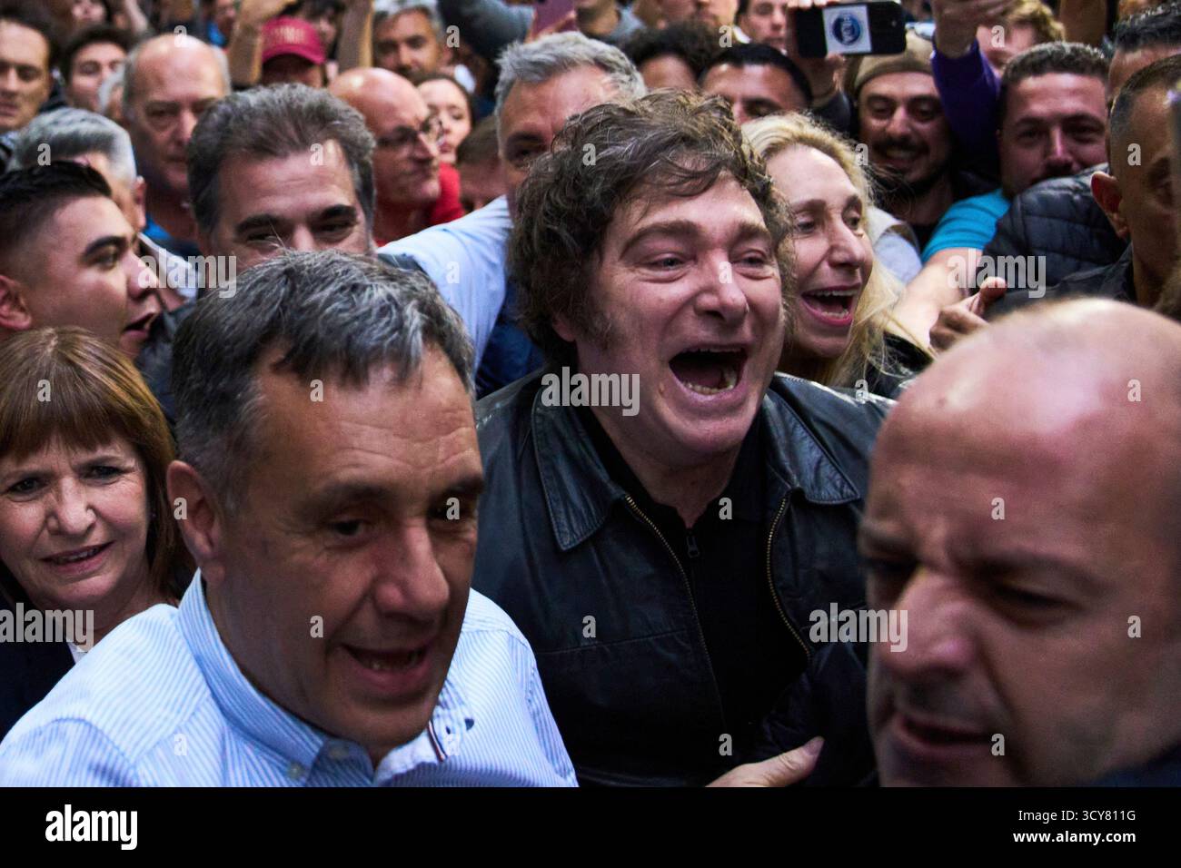 President Javier Milei greets supporters during a campaign rally ahead ...