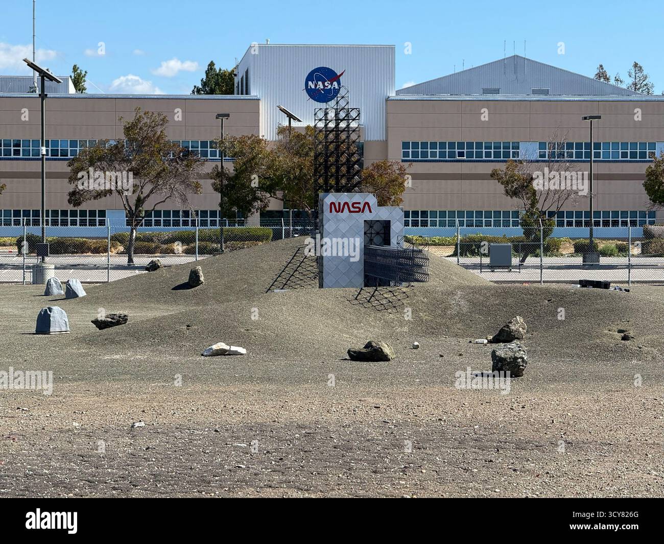 Artificial lunar surface simulation area with rocks and soil in front ...