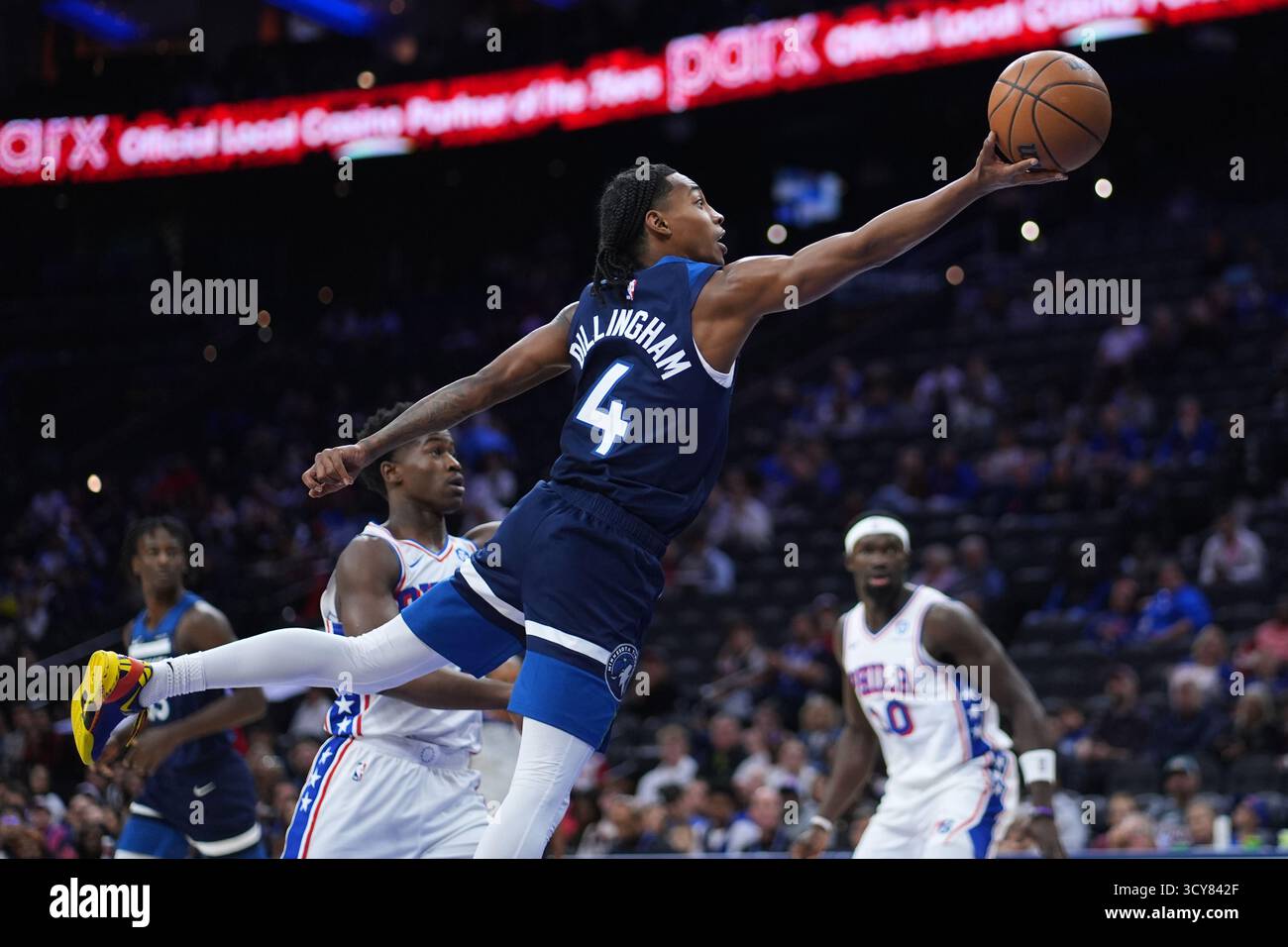 Minnesota Timberwolves' Rob Dillingham goes up for a shot past ...