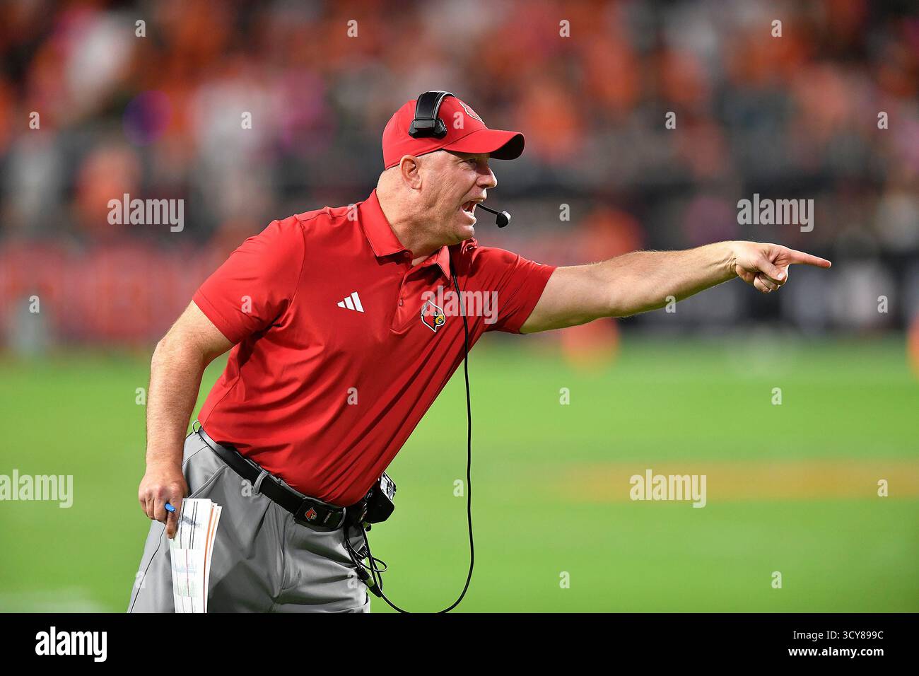 Louisville head coach Jeff Brohm questions a call during the first half ...