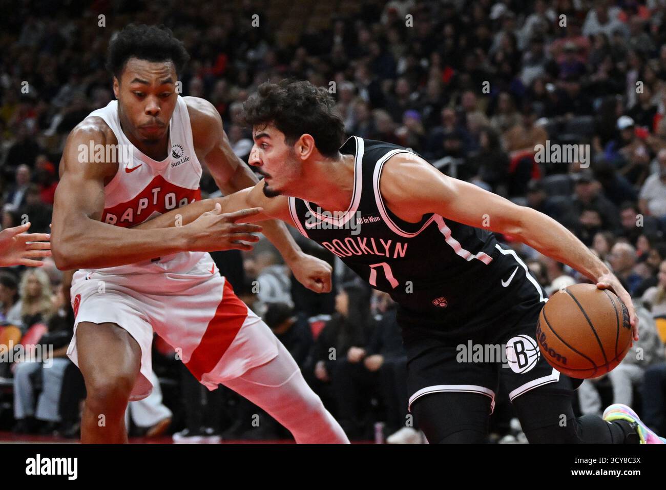 Brooklyn Nets' Ben Saraf, right, moves around Toronto Raptors' Scottie ...