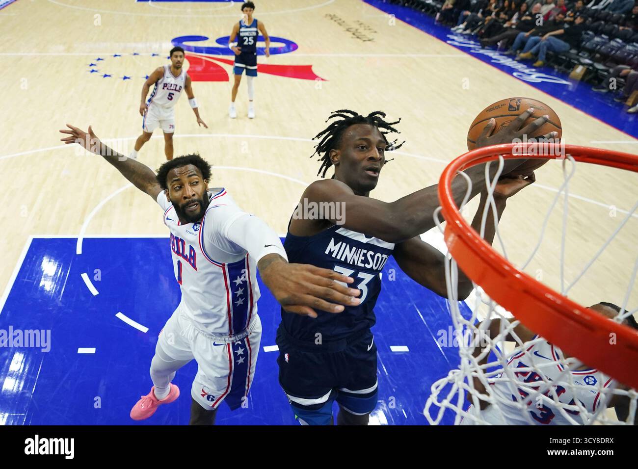 Minnesota Timberwolves' Leonard Miller, right, goes up for a shot ...