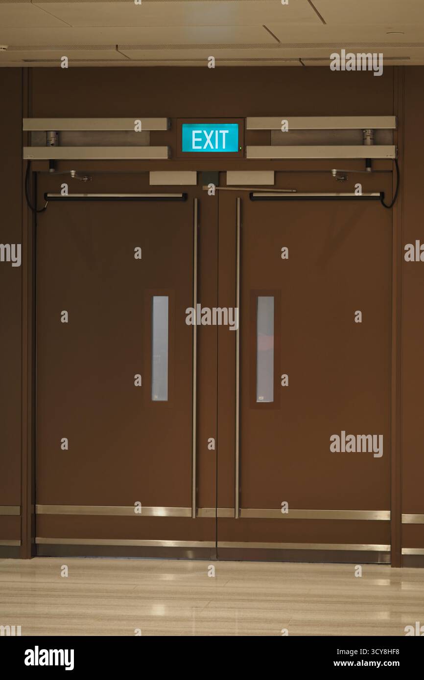 Exit doors with clear signage in a modern building hallway Stock Photo ...